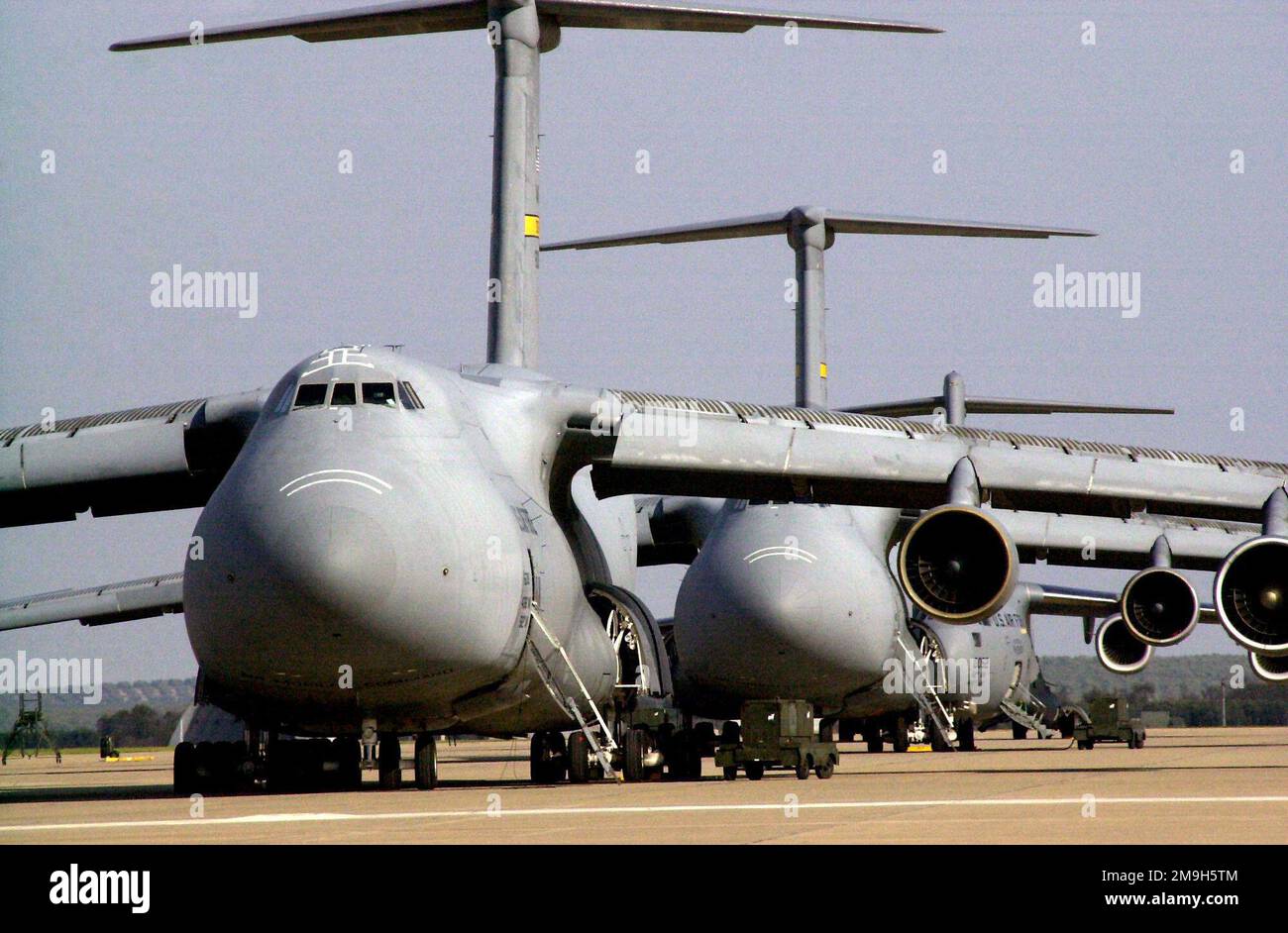 A line of C 5 Galaxy cargo aircraft on the flightline at Moron Air Base ...