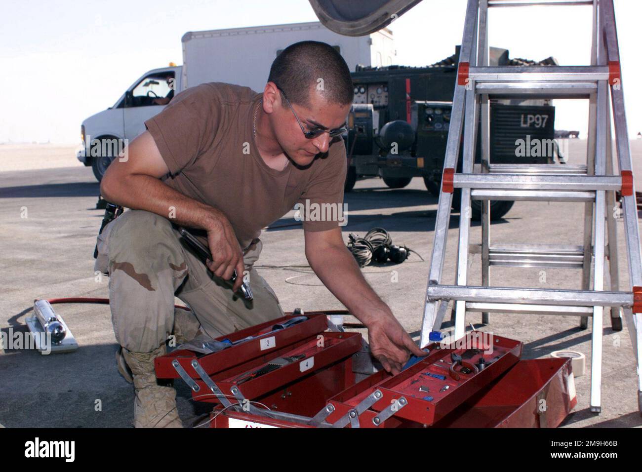 Crew CHIEF, SENIOR AIRMAN (SRA) Roman Abrego secures his tools, at a ...