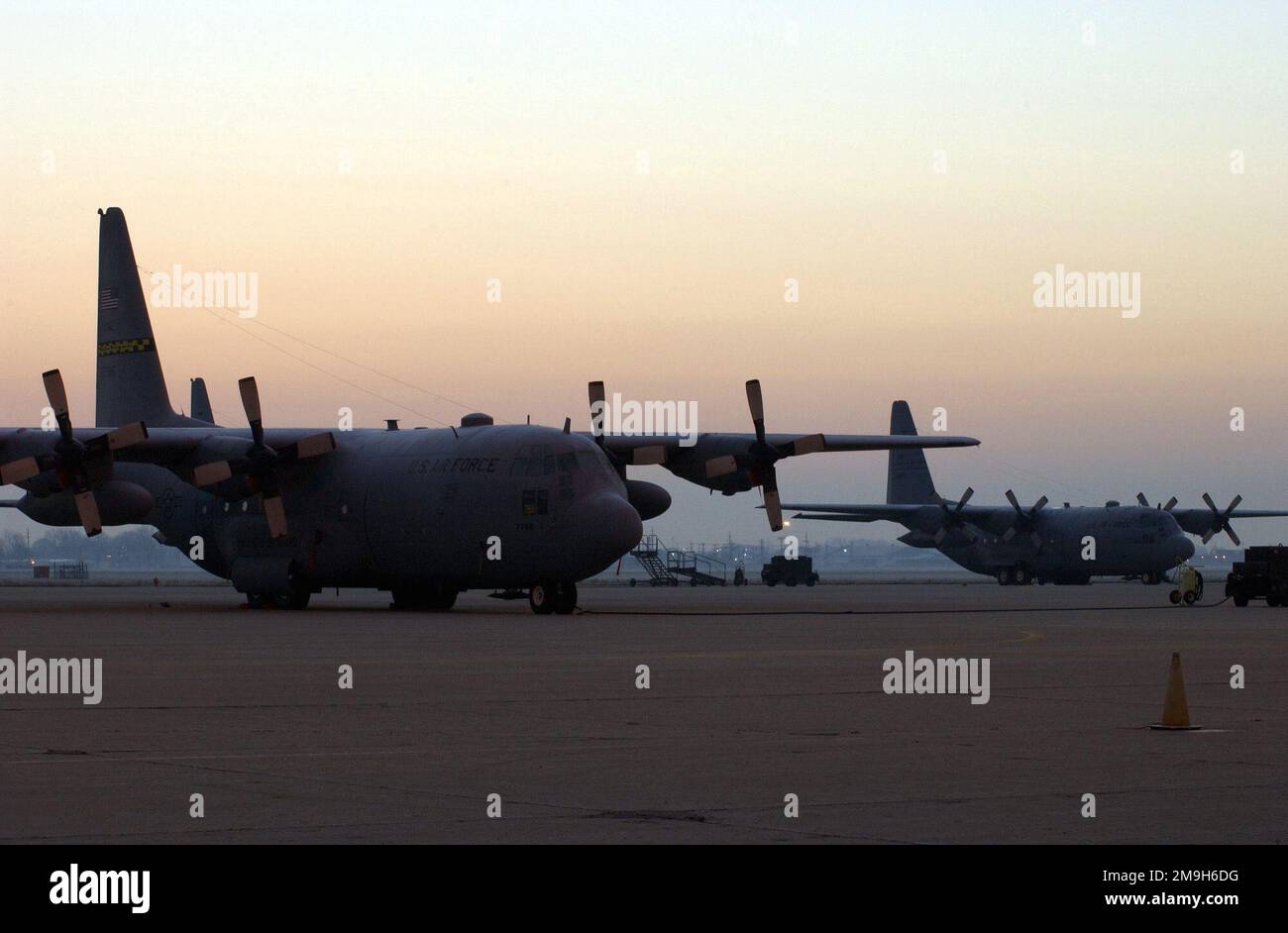 Two US Air Force (USAF) C-130 Hercules aircraft standing ready on the ...