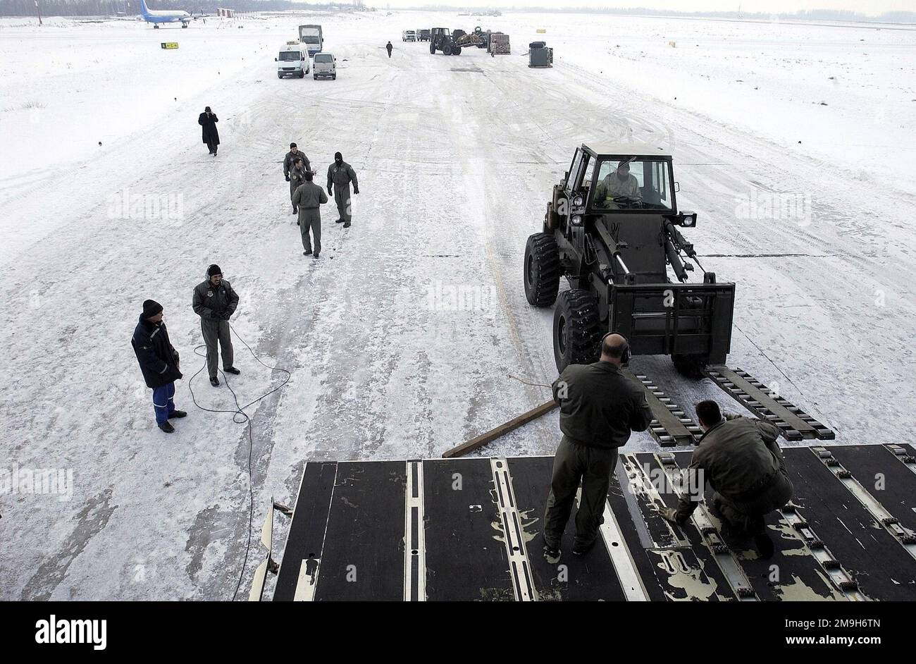 United States Air Force Reserve aircrew members offload personnel and ...