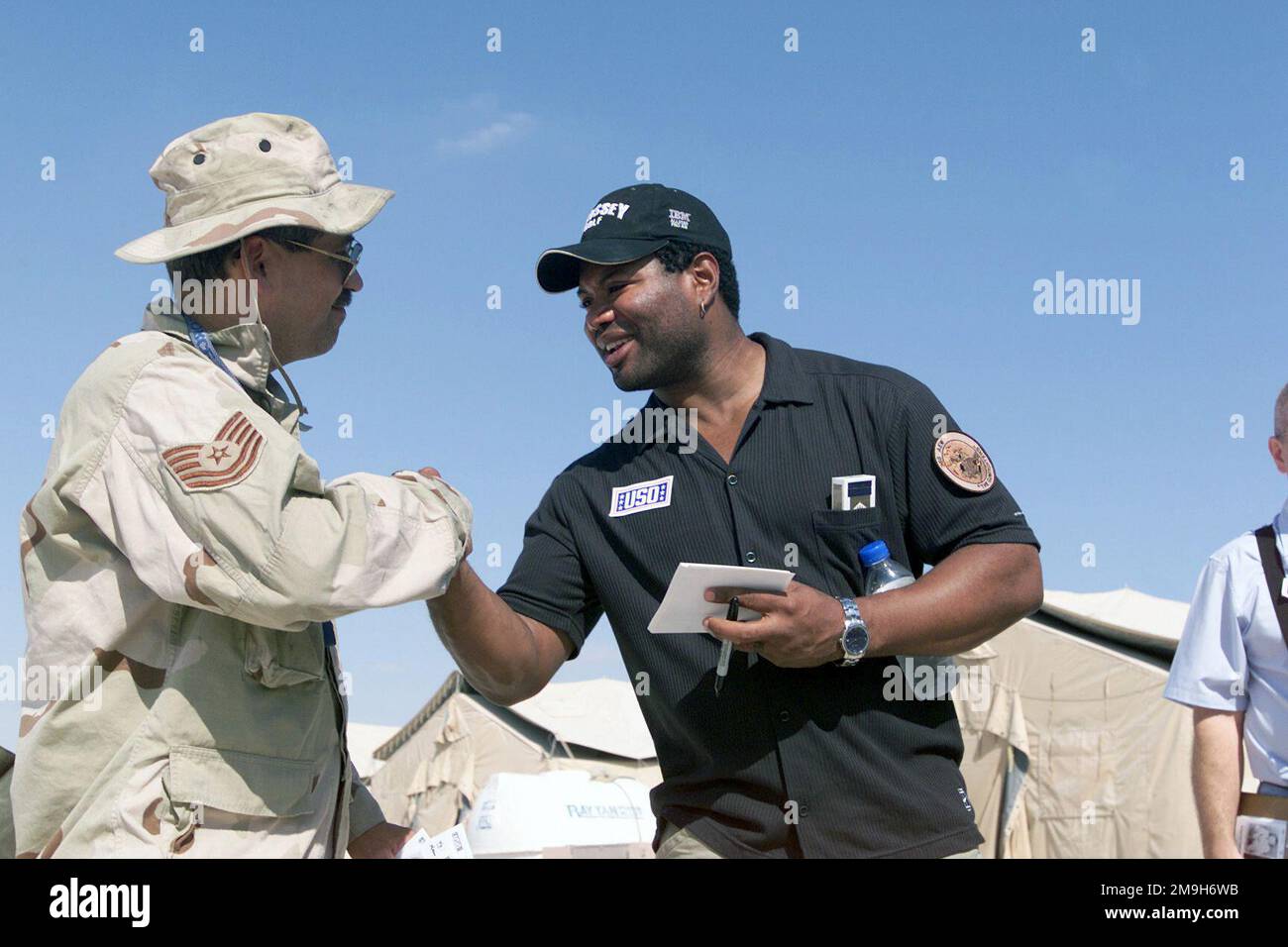 Technical Sergeant (TSGT) David Saylor (left) shakes hands with actor ...