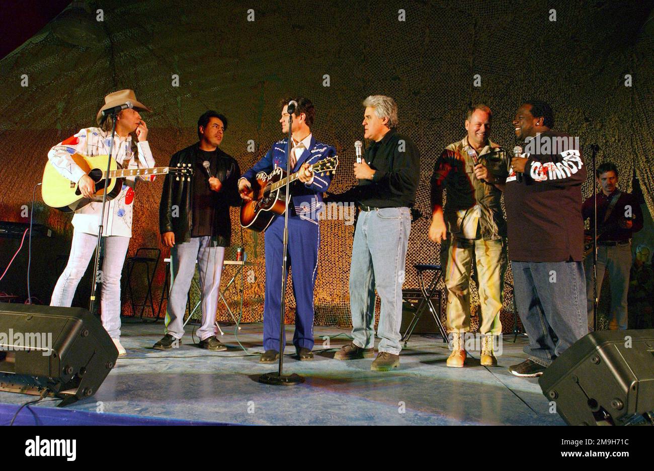 Dwight Yokum (left), Willie Barcena (next), Chris Isaak (at mike), Jay ...