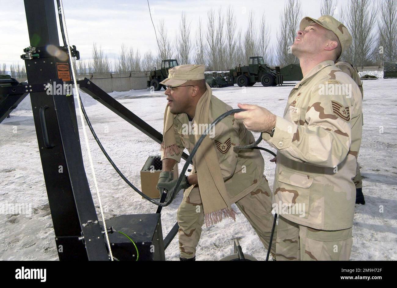Technical Sergeant (TSGT) Jackie Cruse is assisted by TSGT Benjamin ...