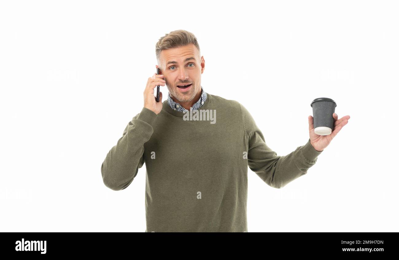 photo of amazed man has call at coffee break. man has call at coffee ...