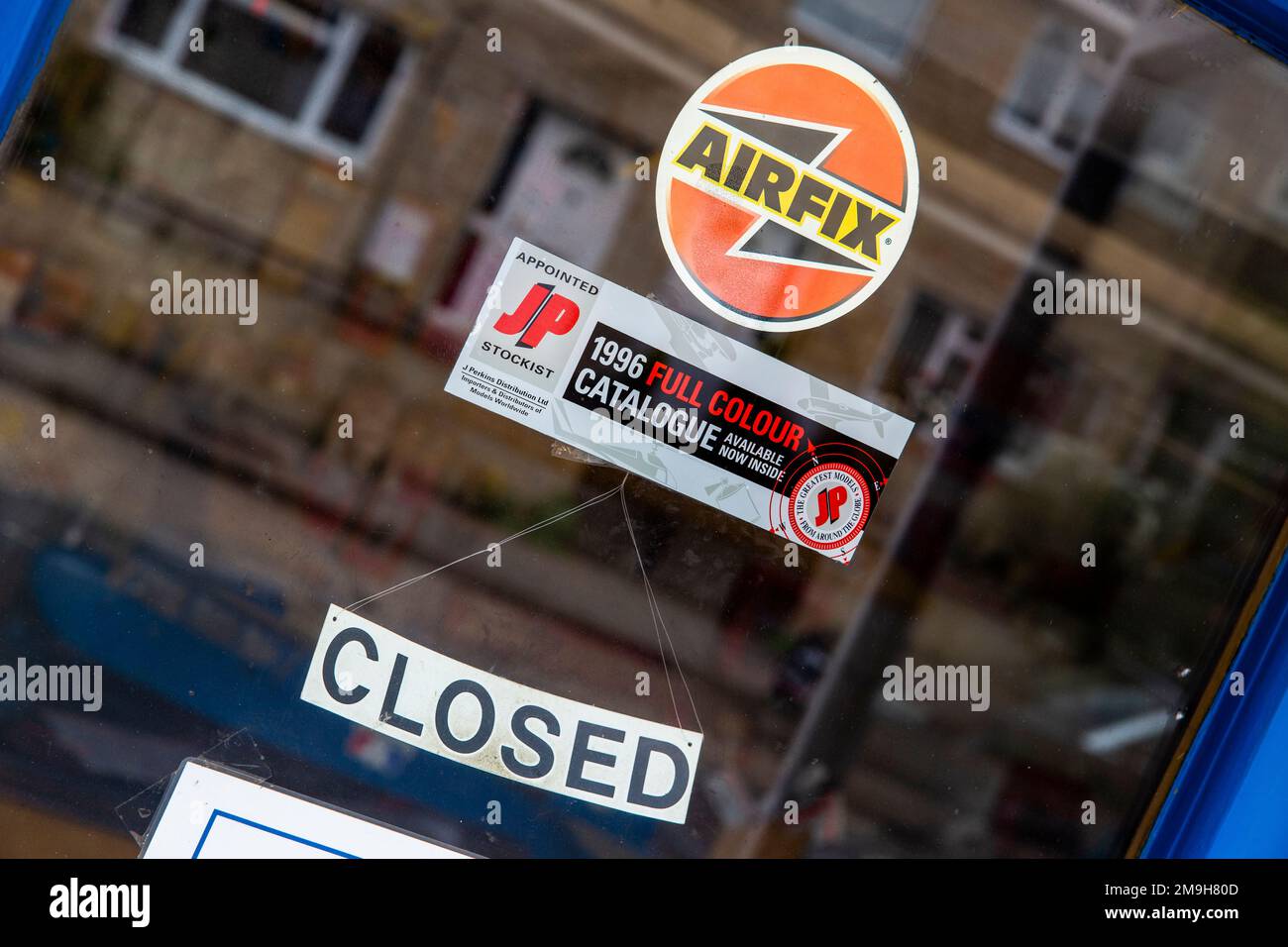 'Closed' sign and old Airfix stickers on door of UK model shop Stock ...