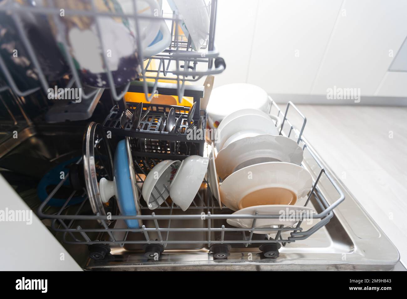 Open dishwasher with clean dishes in the white kitchen Stock Photo - Alamy