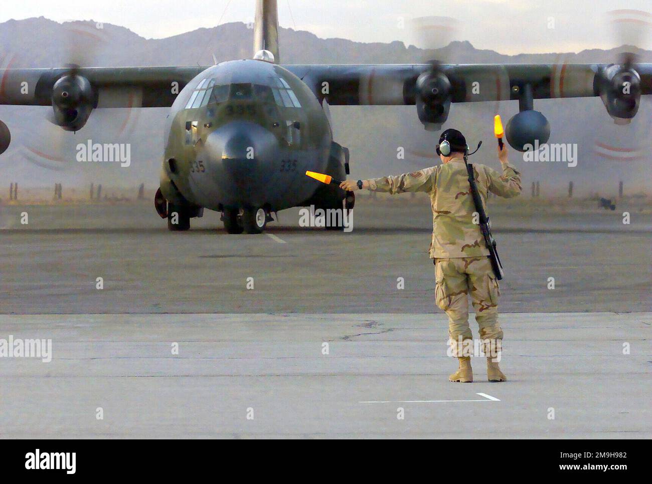 With an M-16 slung over his shoulder an Air Force Technical Sergeant ...