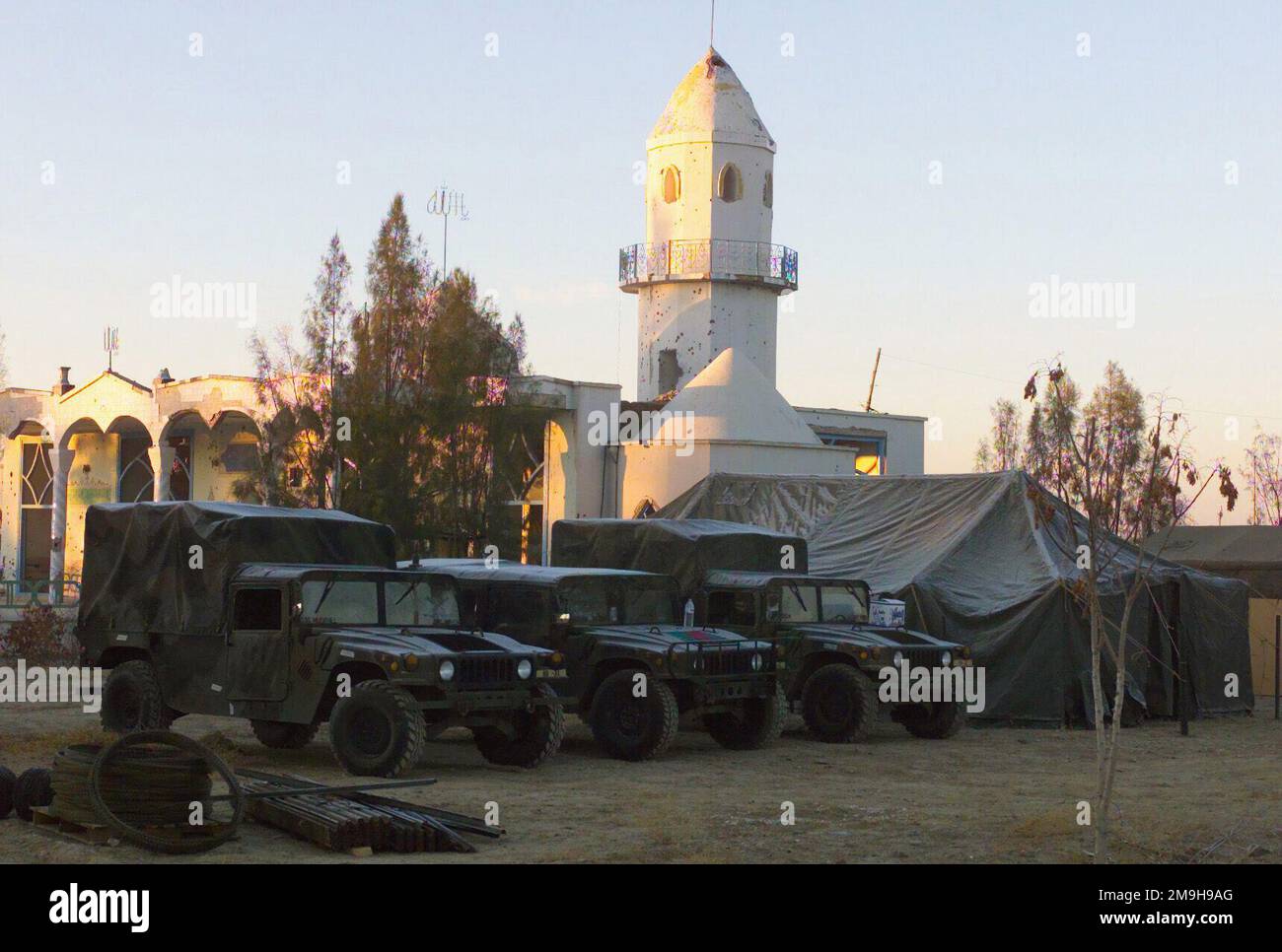 US High-Mobility Multipurpose Wheeled Vehicle (HMMWV) sit under a ...
