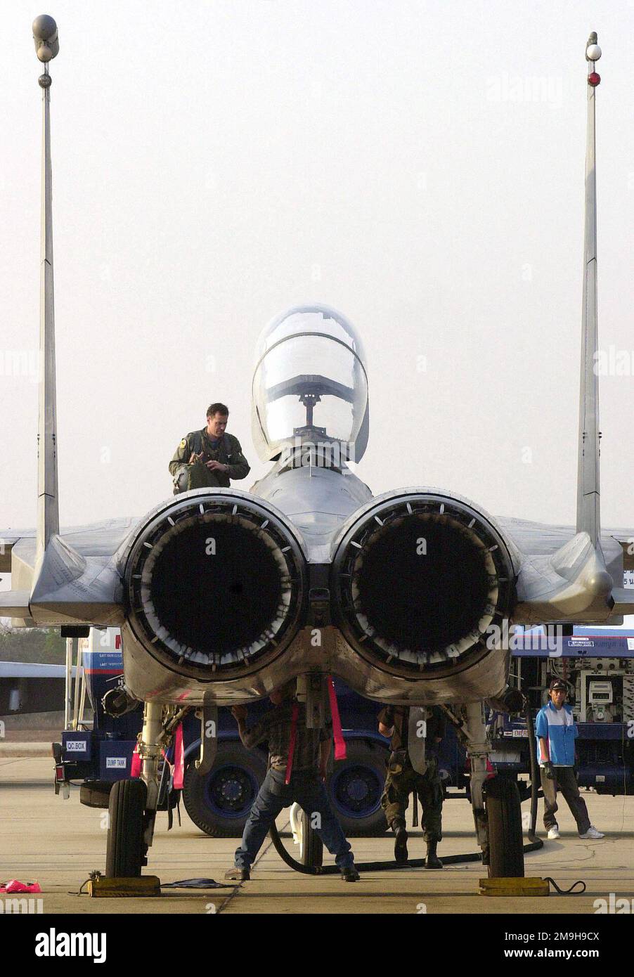 Ground crew personnel service the aircraft as US Air Force (USAF ...