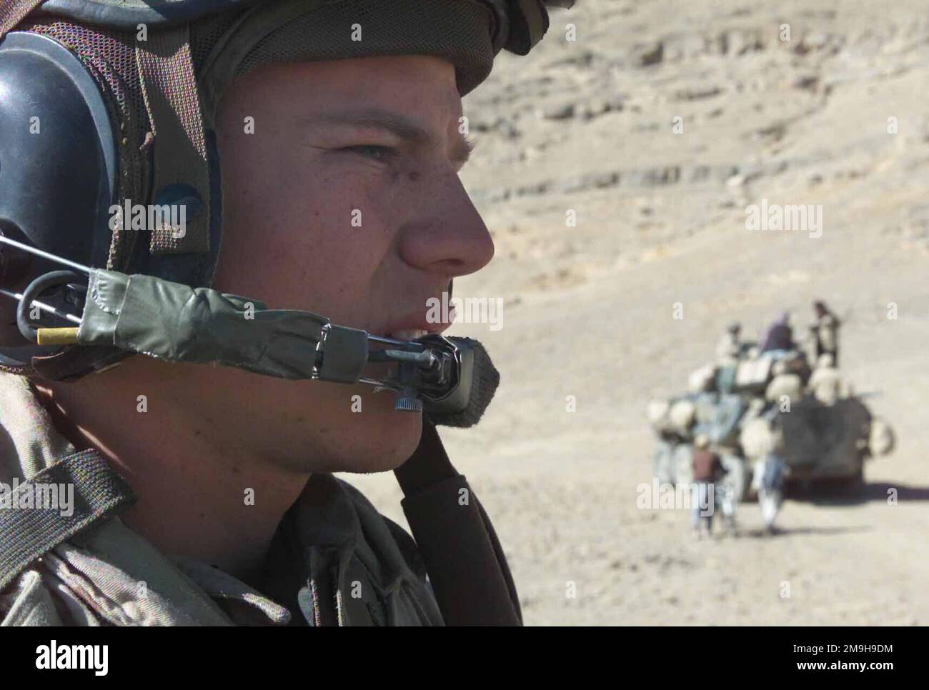 Marine Corporal David Easter communicates with his patrol leader while ...