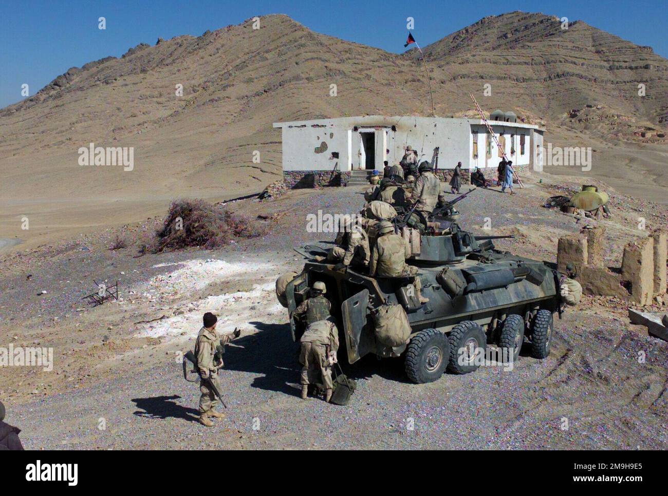 Marines, with M-16s ready, from Alpha Company, Second LIght Armored ...