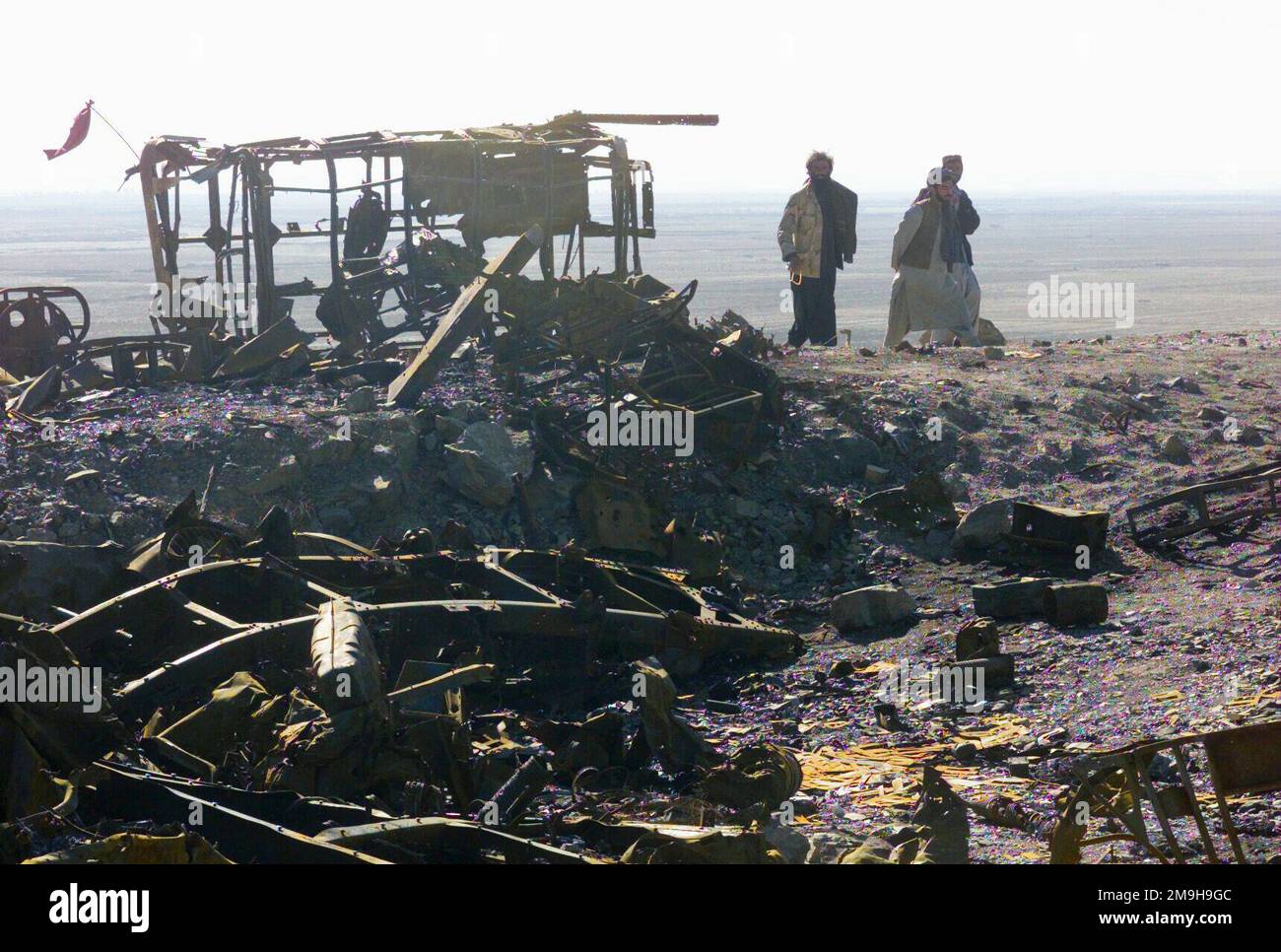 Members of the Anti-Taliban Forces (ATF) walk around a Soviet surface ...