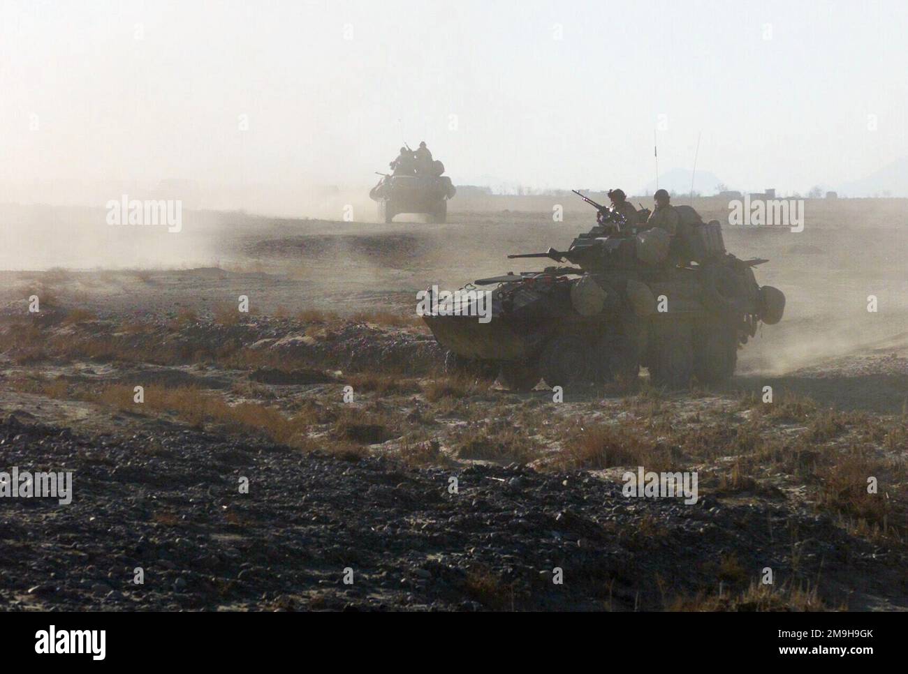 Kicking up a bit of a dust cloud, two Marine LAV-25s (Light Armored ...