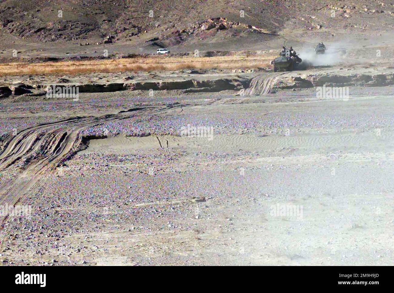 Generating dust along the dirt road Marines with Alpha Company, Second ...