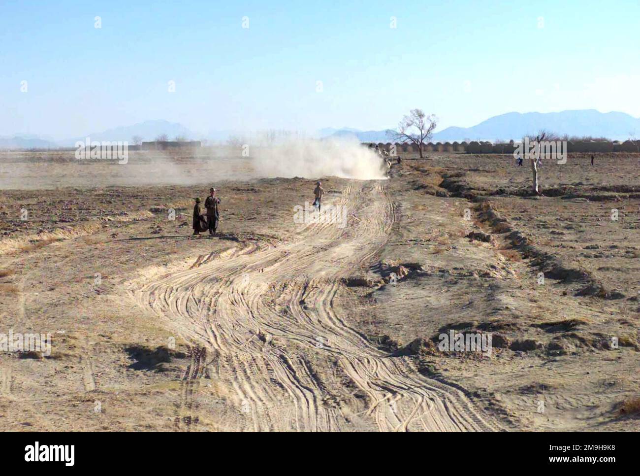 Afganistan civilians watch as Marines with Alpha Company, Second Light ...