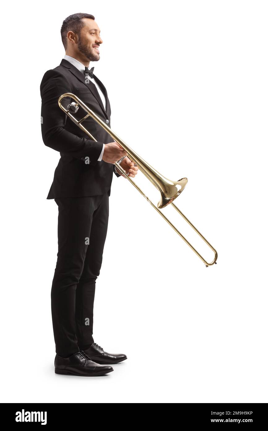 Full length profile shot of trombone player standing and smiling ...