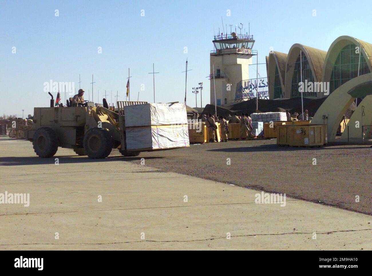 Using an 10K-AT forklift a Marine transports a pallet of material in ...