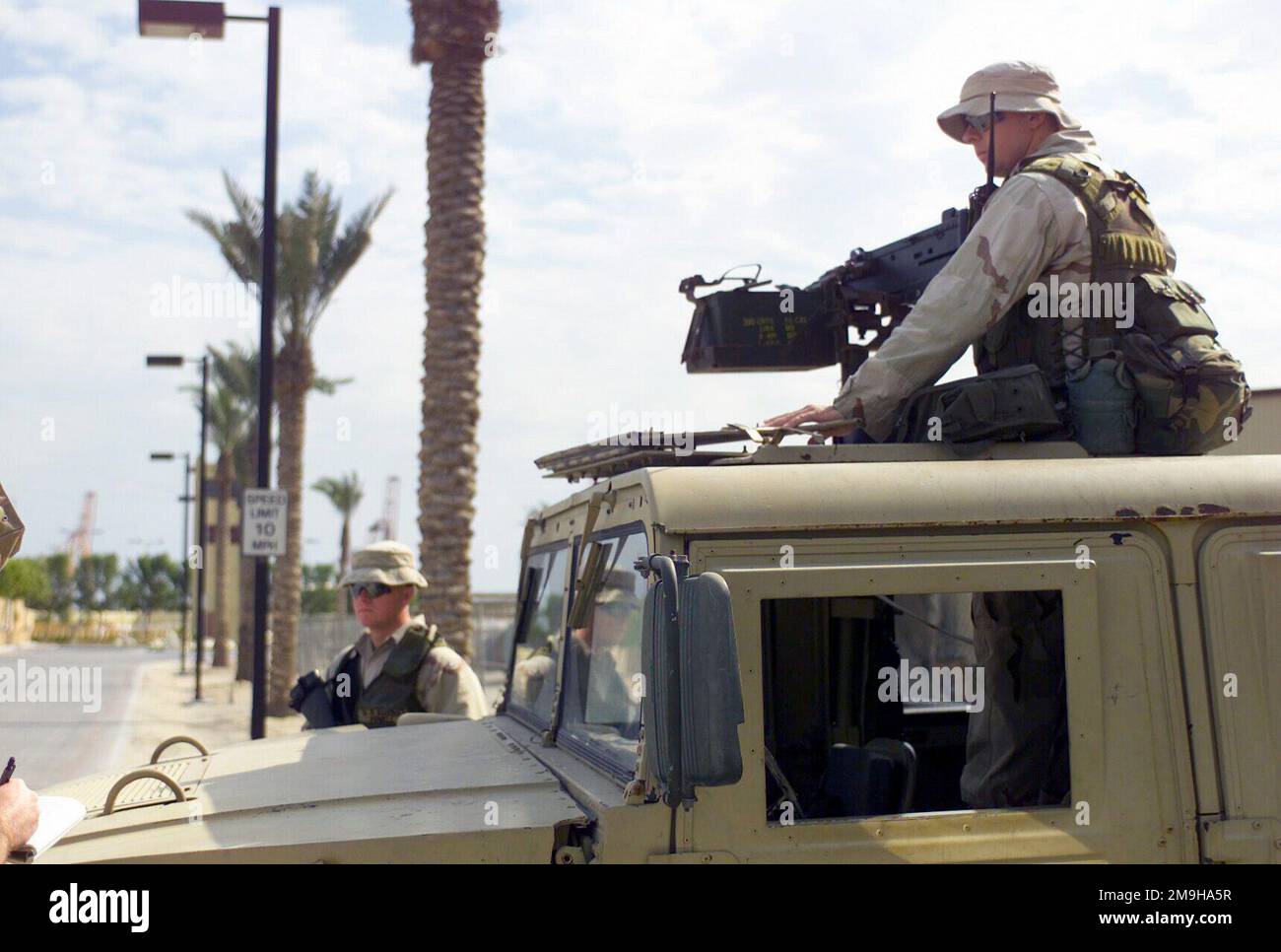 Lance Corporal (LCPL) Andrew D. Bishop, USMC, mans the M2HB .50-Quick ...