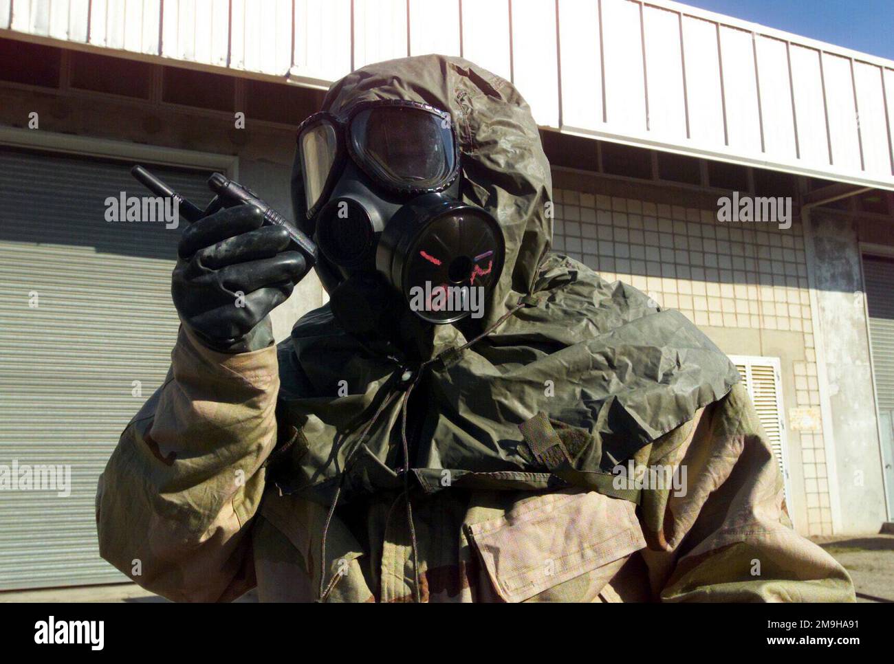 A Marine from the Combined Joint Task Force (CJTF) does a ...