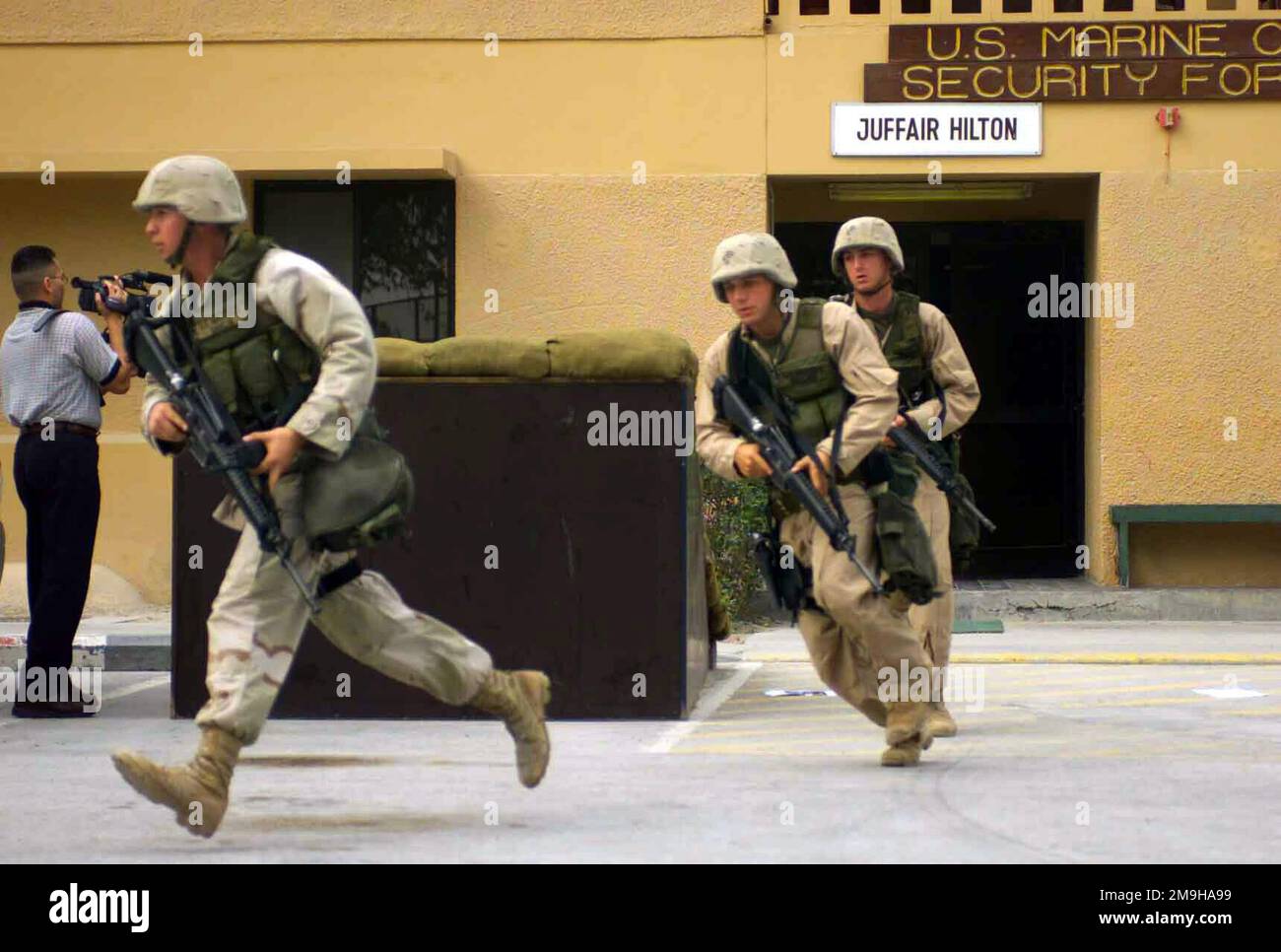 Lance Corporal (LCpl) Andrew R. Garcia, USMC, with M16A2 leads his team ...