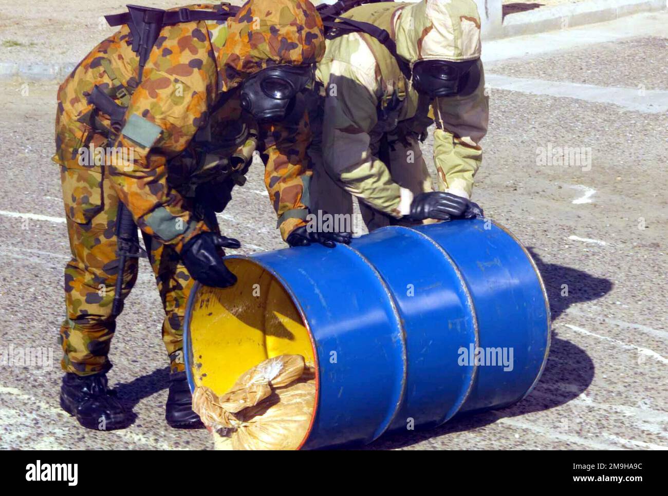 A Marine from the Combined Joint Task Force (CJTF) and an Australian ...
