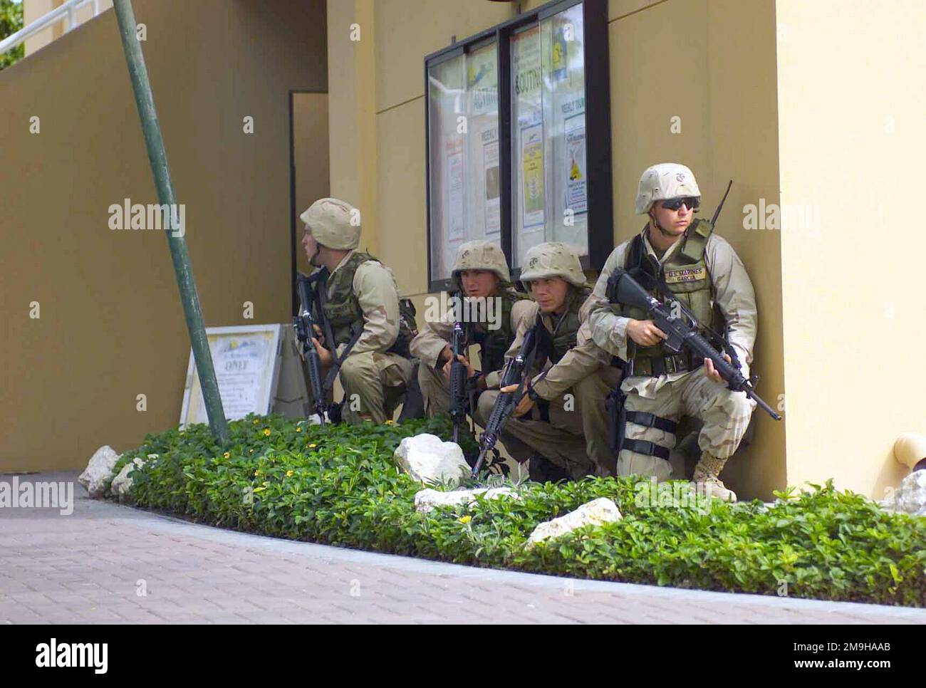 Wearing flack vests, Lance Corporal (LCpl) Robert M. Sena, Private ...