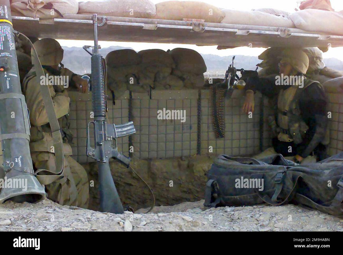 In an improved fighting hole along the camp perimeter, Lance Corporal ...