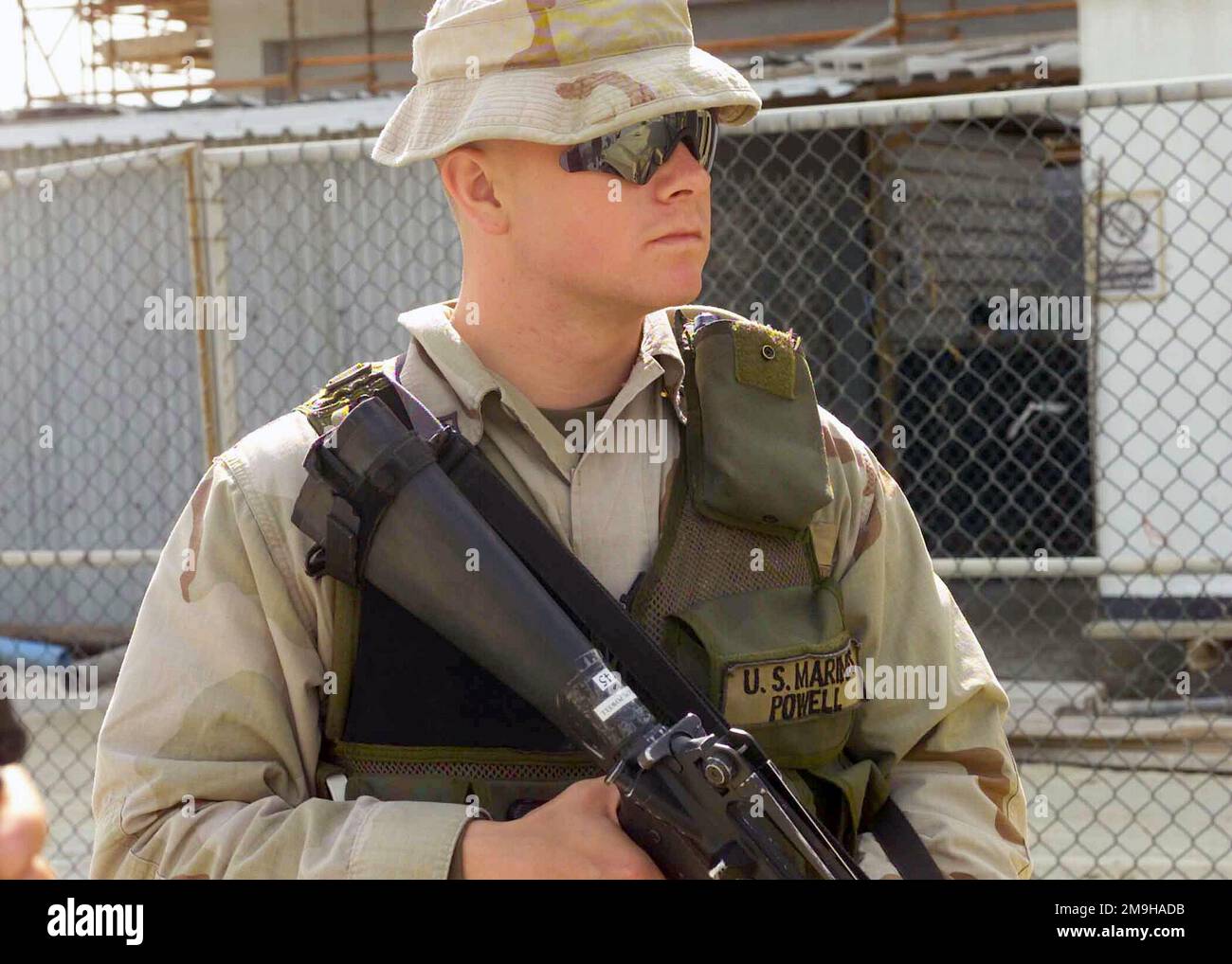 Lance Corporal Andrew P. Powell, USMC, provides foot security as part ...