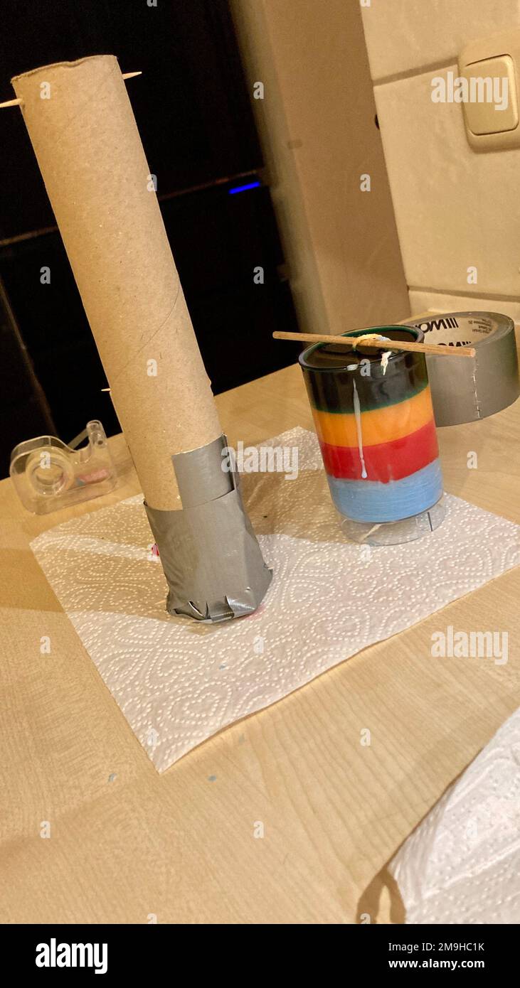 A vertical shot of two handmade candles on a table Stock Photo - Alamy