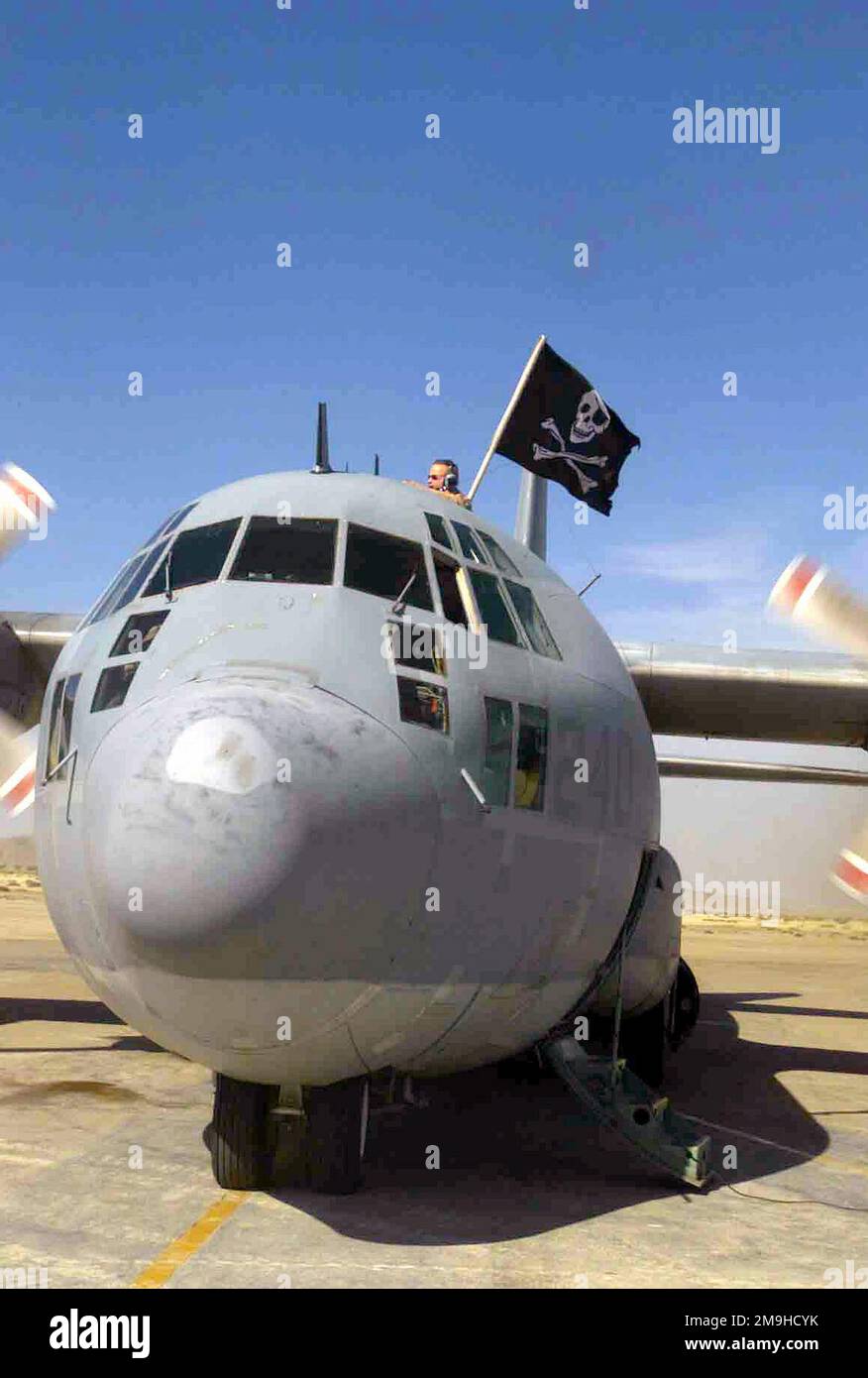 At a forward operating base, with their Skull and Cross Bones" flag ...