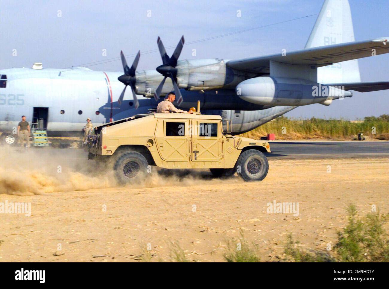 As they pass a Marine KC-130/R, Sergeant Joseph Cook, USMC, Marine ...