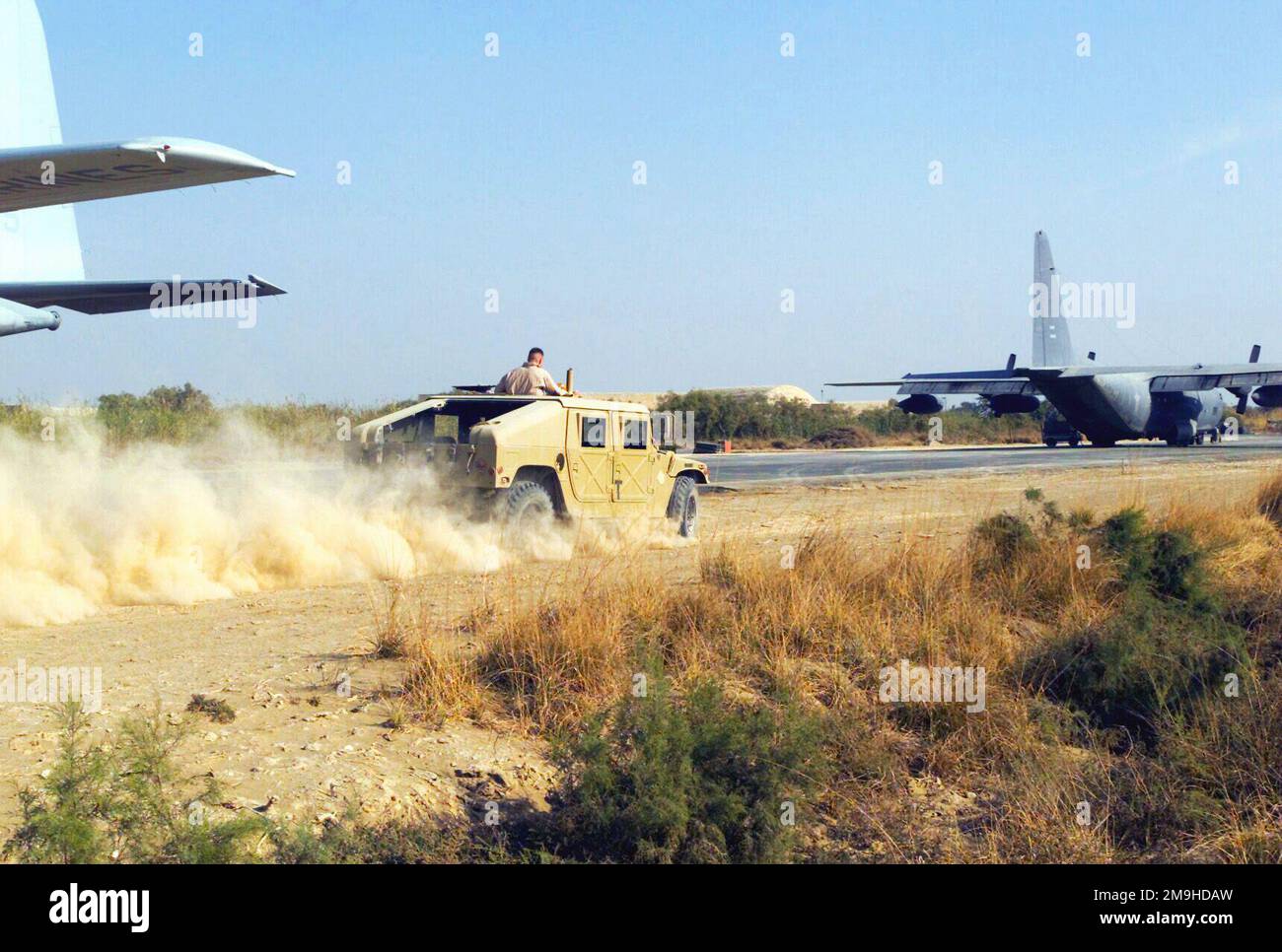 As they pass a Marine KC-130/R, Sergeant Joseph Cook, USMC, Marine ...