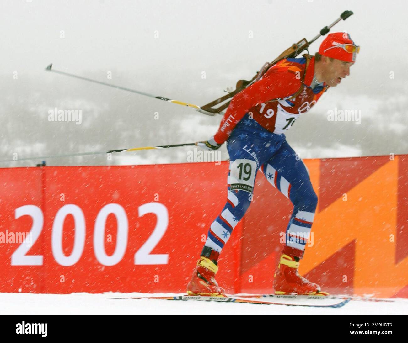 With his .22 caliber, bolt-action rifle slung on his back, World Class ...