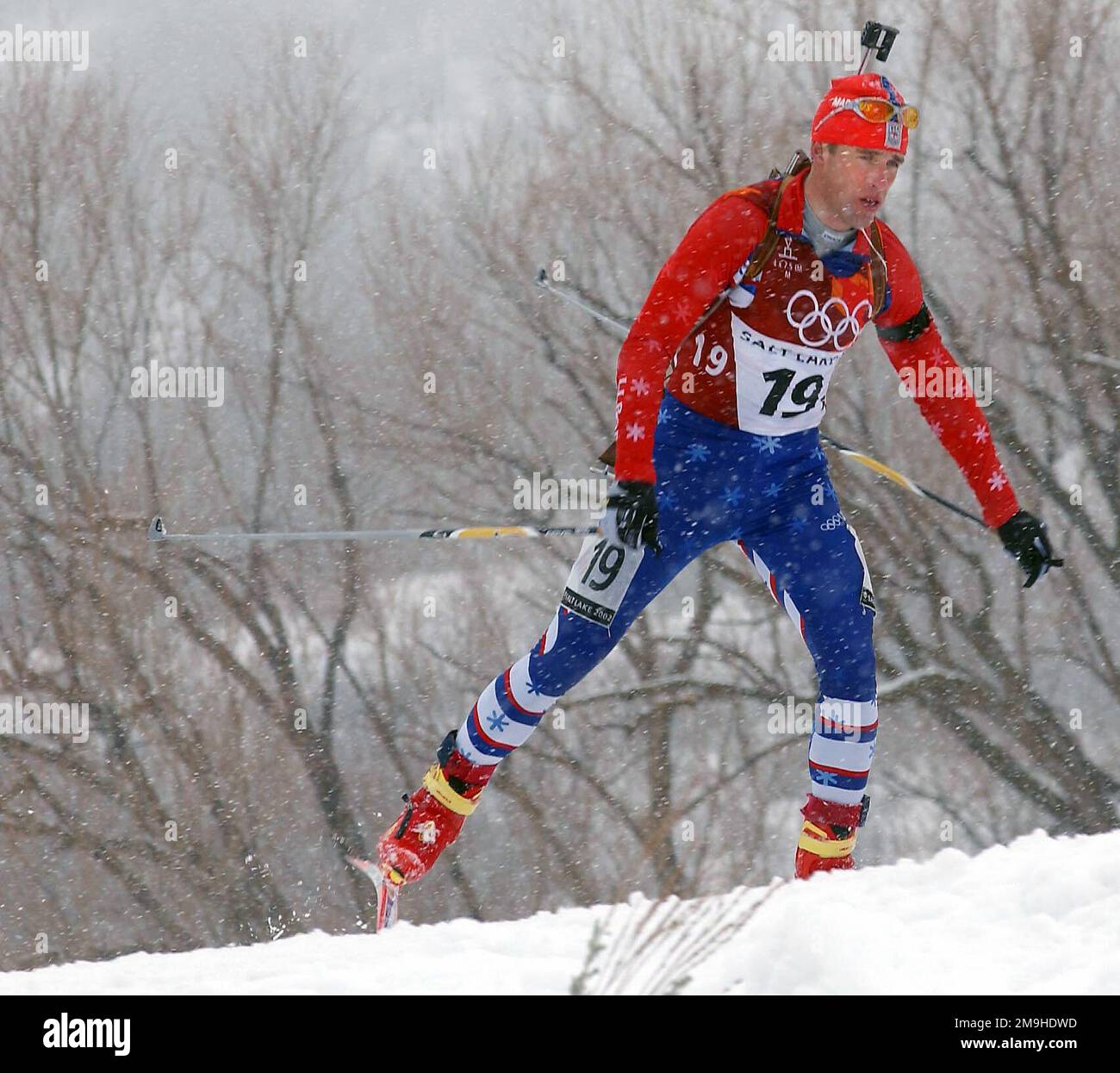 With his .22 caliber, bolt-action rifle slung on his back, World Class ...