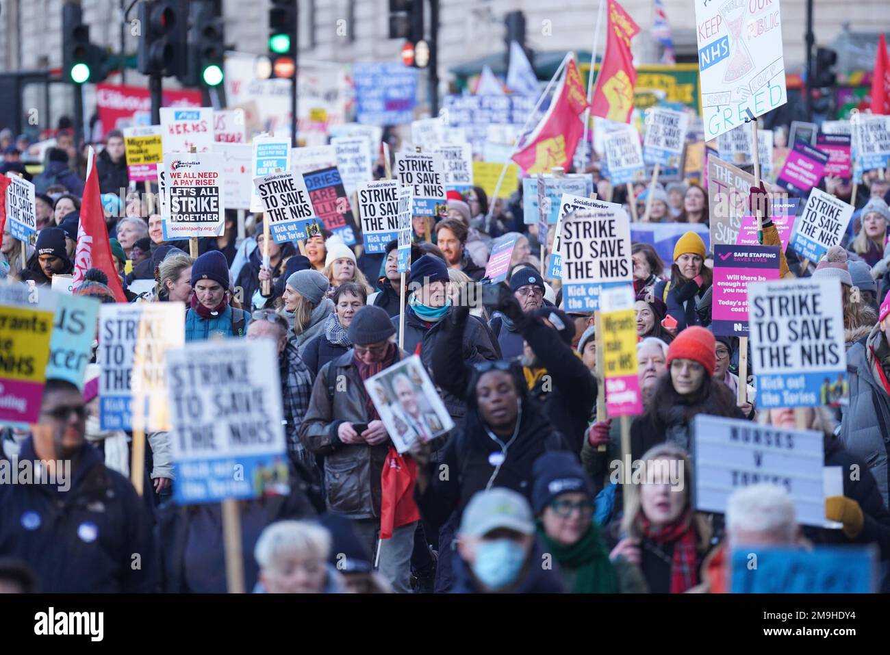 Protesters march through Trafalgar Square, towards Downing Street ...