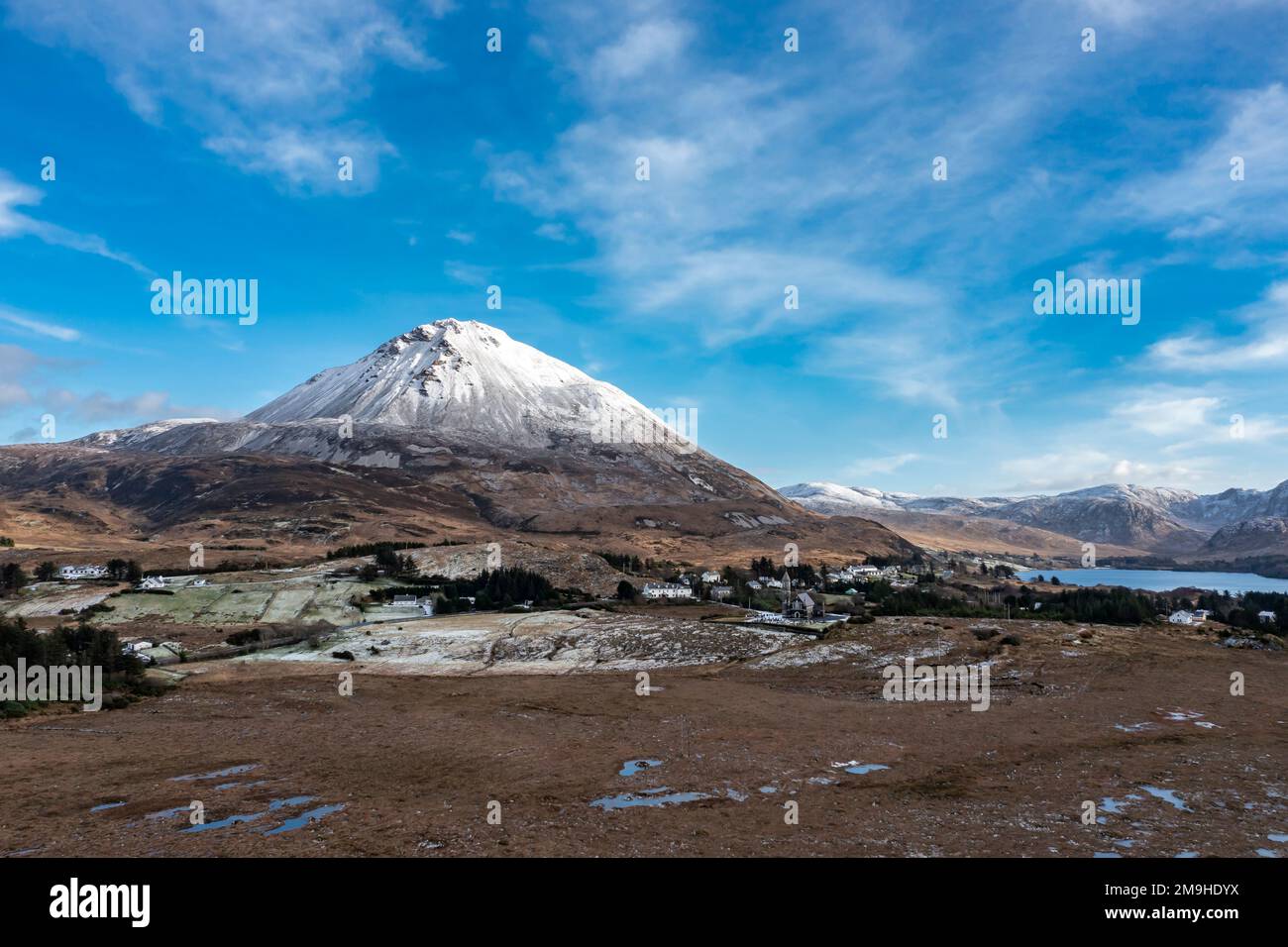 Aerial view of the snow covered Mount Errigal, the highest mountain in ...