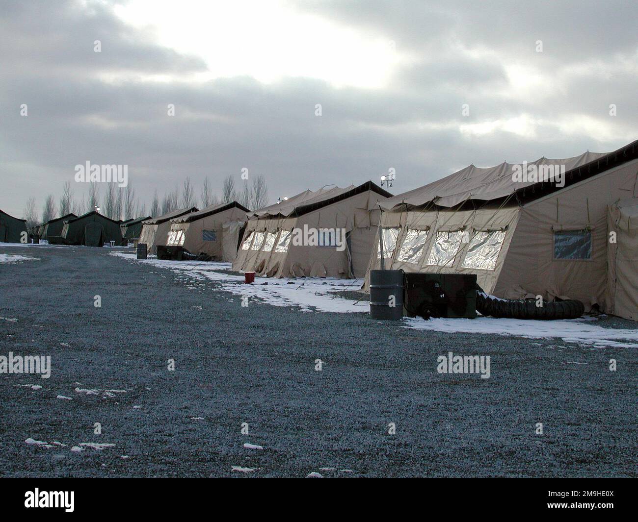 The sun sets on tent-city at Manas International Airport, Ganci Air ...