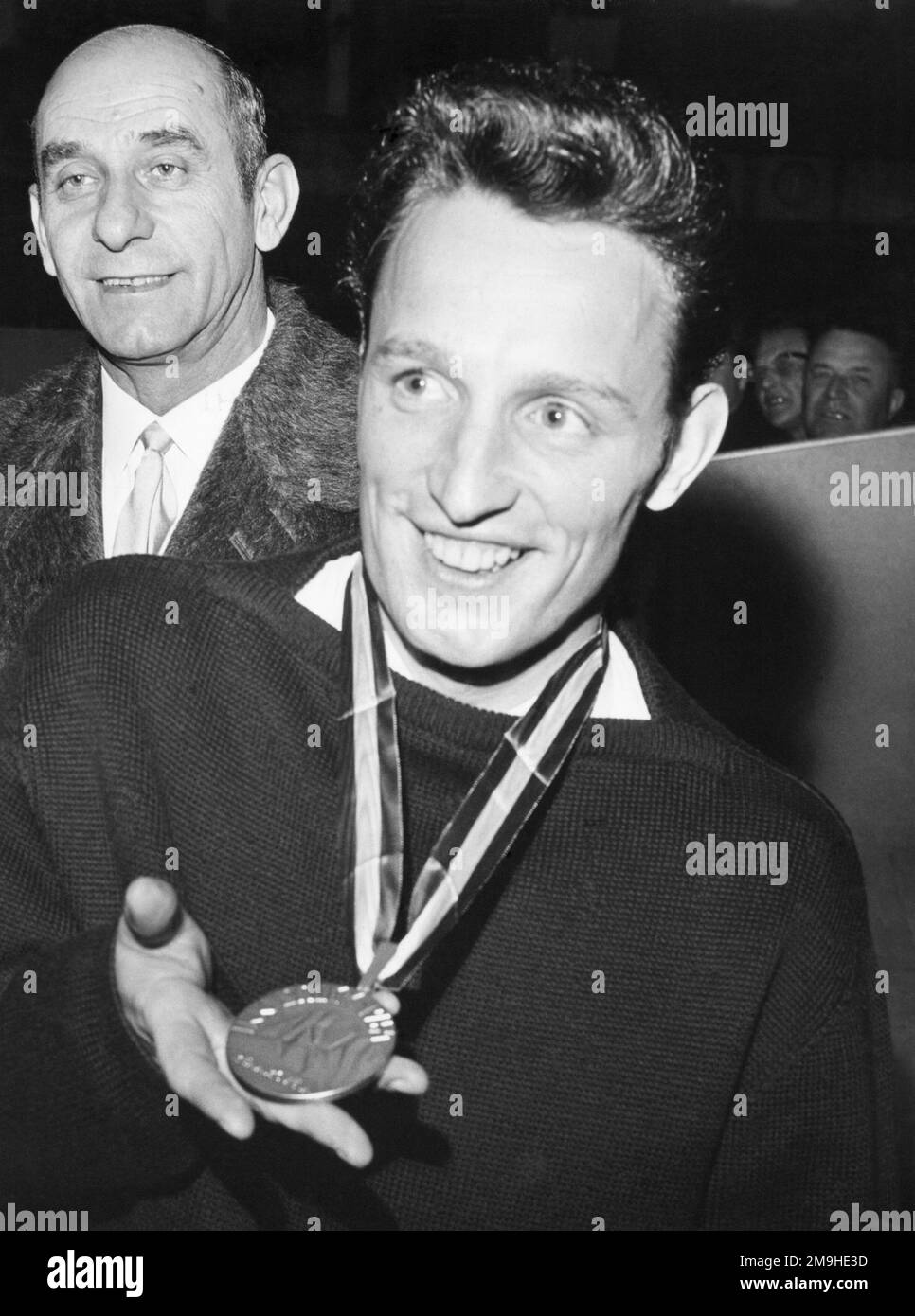 Thomas Koehler with his luge gold medal after the medal ceremony at the ...