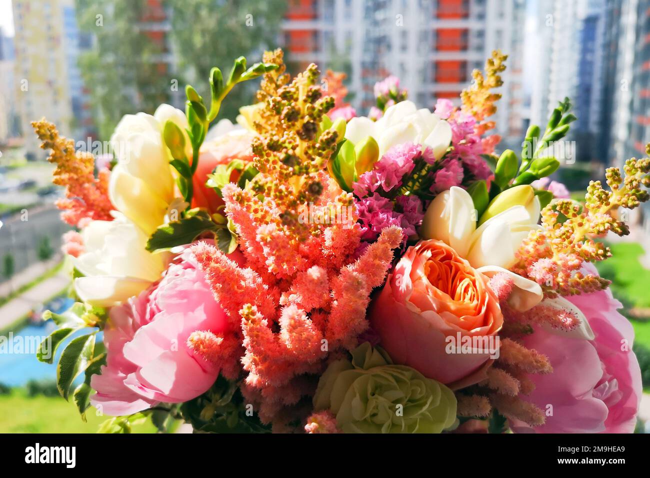 colorful bouquet with peonies, astilbe, freesia, peony roses Juliet ...