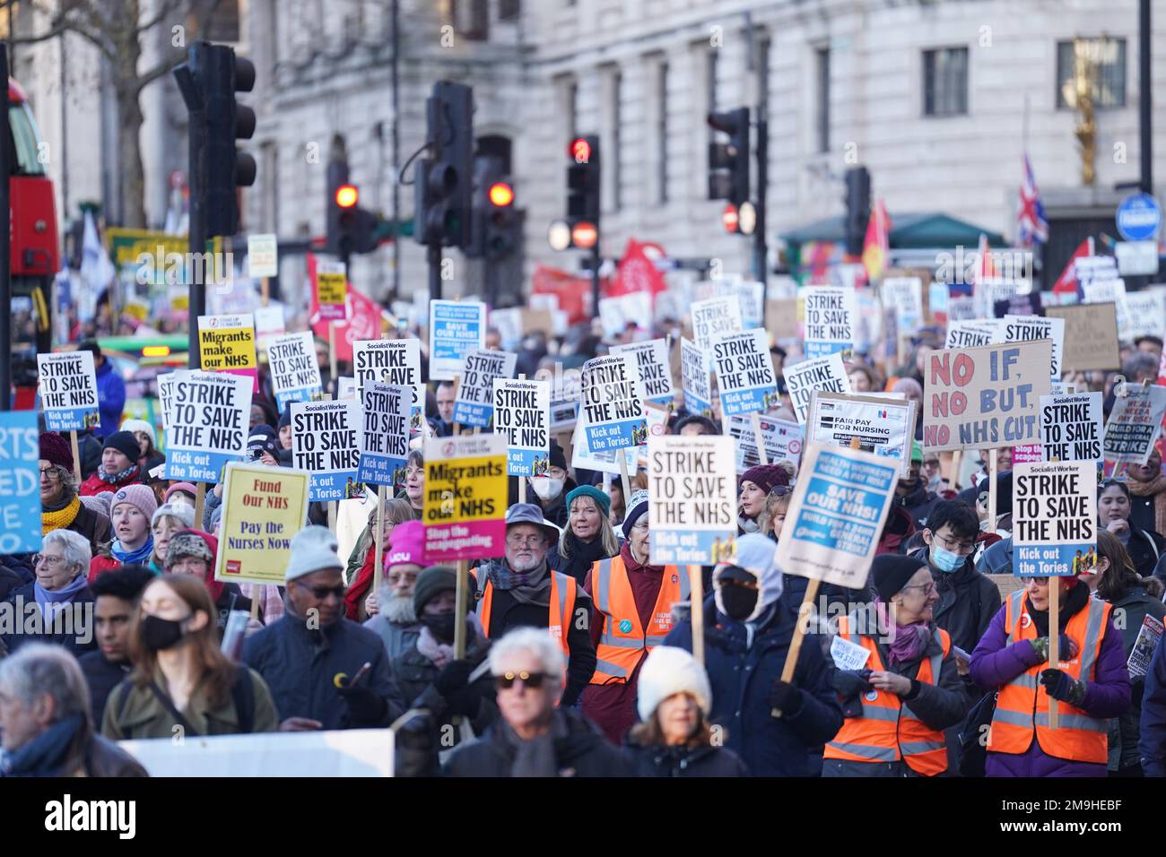Protesters march through Trafalgar Square, towards Downing Street ...