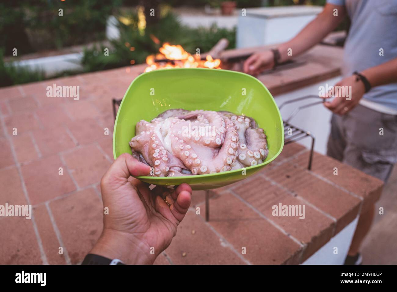 Summer barbecue with octopus in the camping in Puglia Stock Photo - Alamy