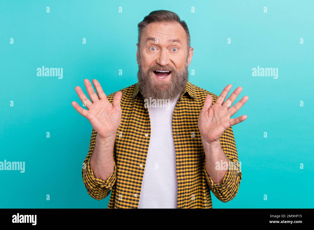 Photo of funky reaction shocked man mature age surprised palms childish ...