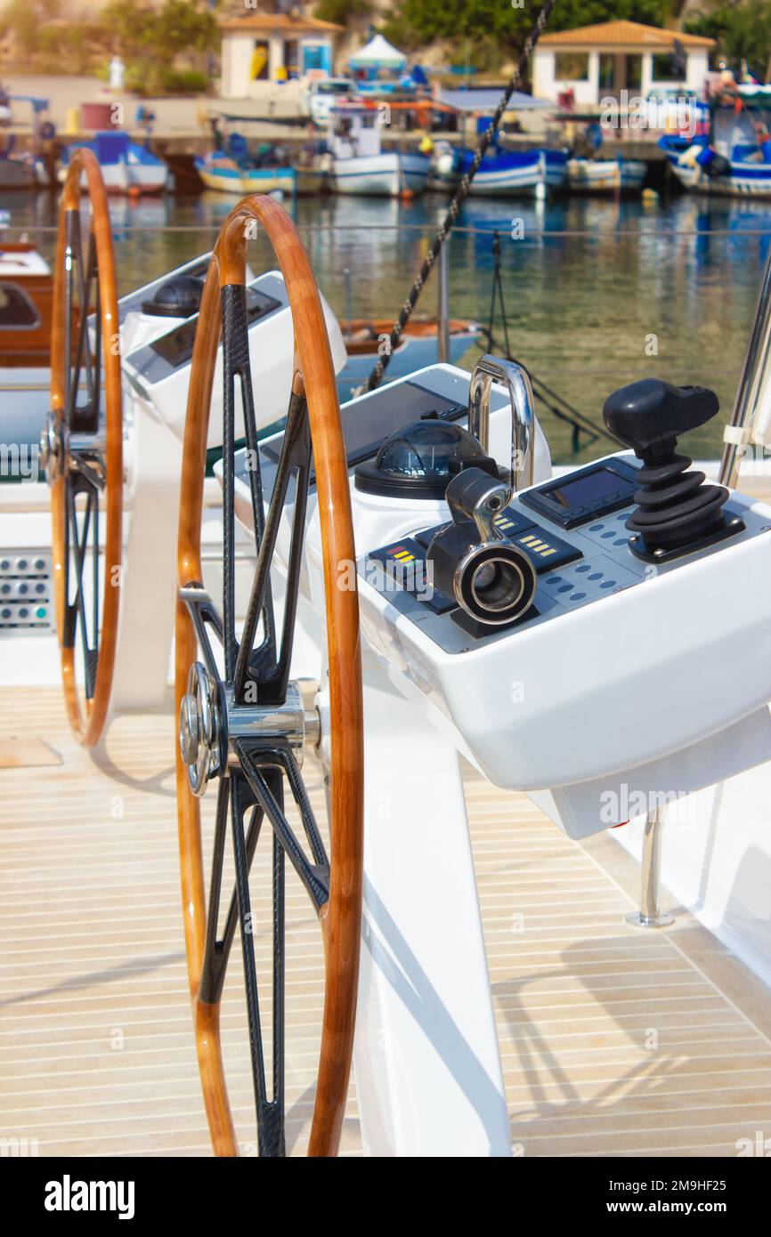 Luxury yacht steering wheels for navigation in sea. Modern vessel boat ...