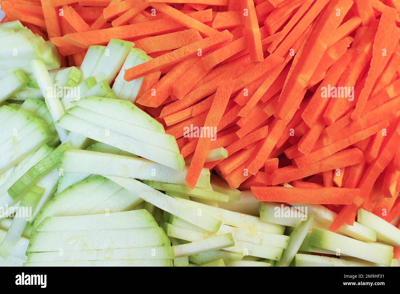 Assorted cut sliced vegetables carrots and zucchini, cutting vegetables ...