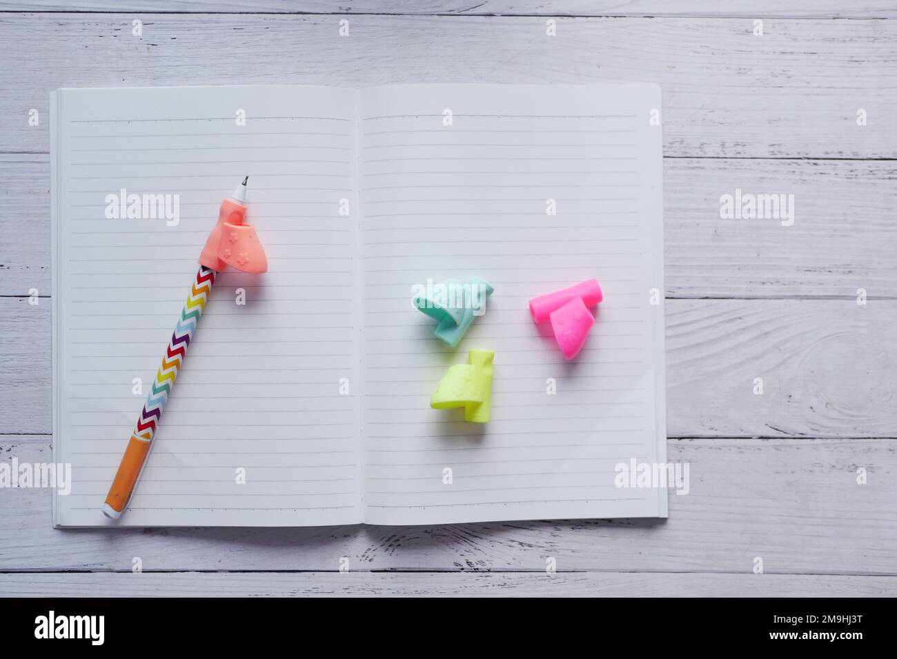 writing corrector pen holder postures grip Stock Photo - Alamy