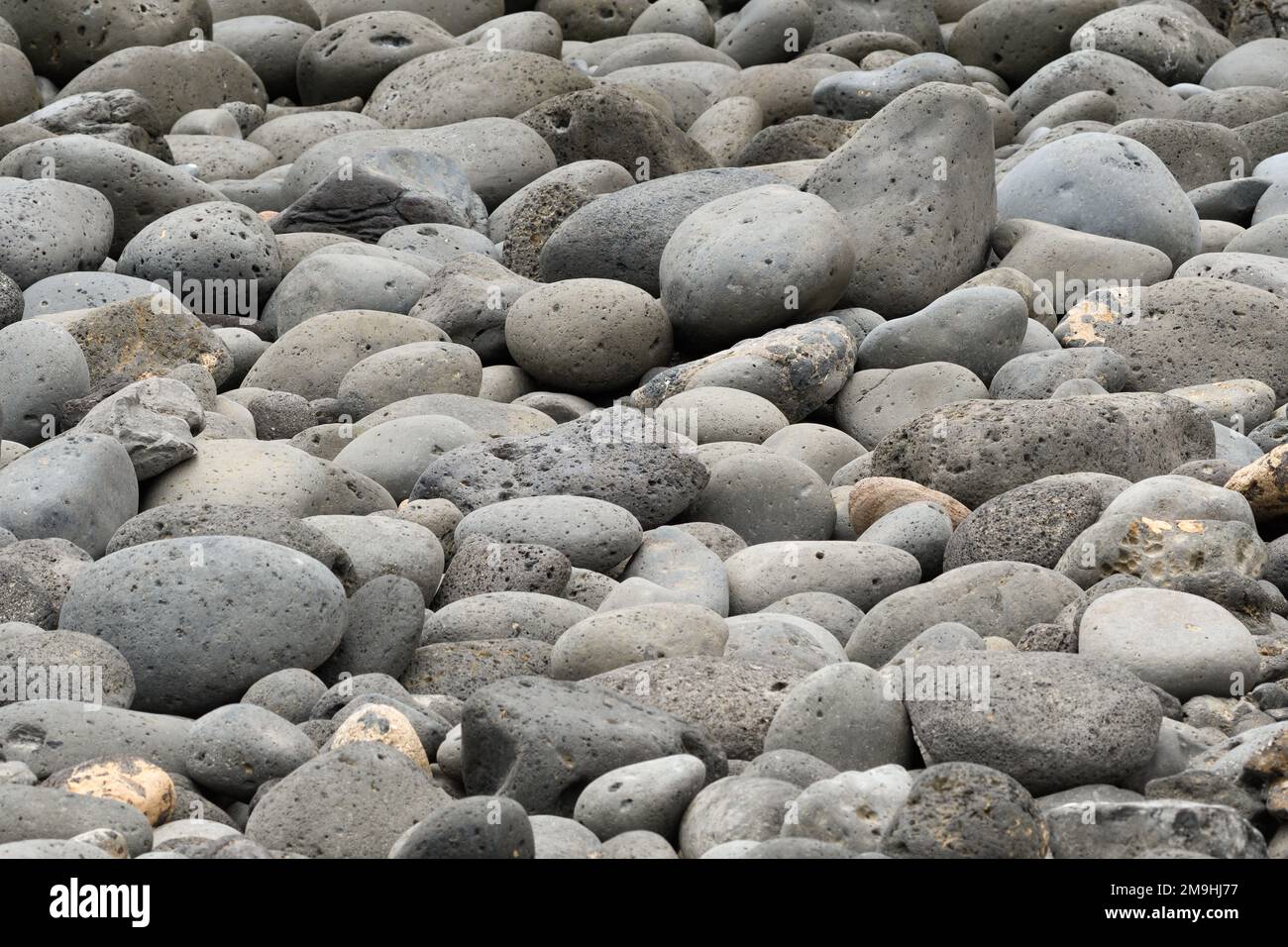 Volcanic rock eroded by the sea at Playa La Cocina Stock Photo - Alamy