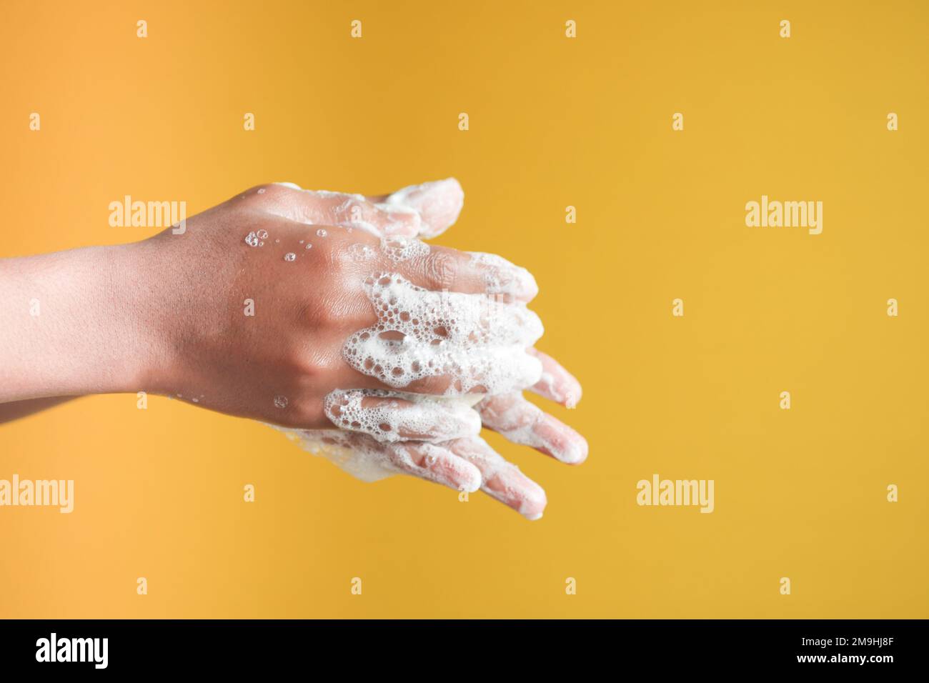 young man washing hands with soap warm water Stock Photo - Alamy