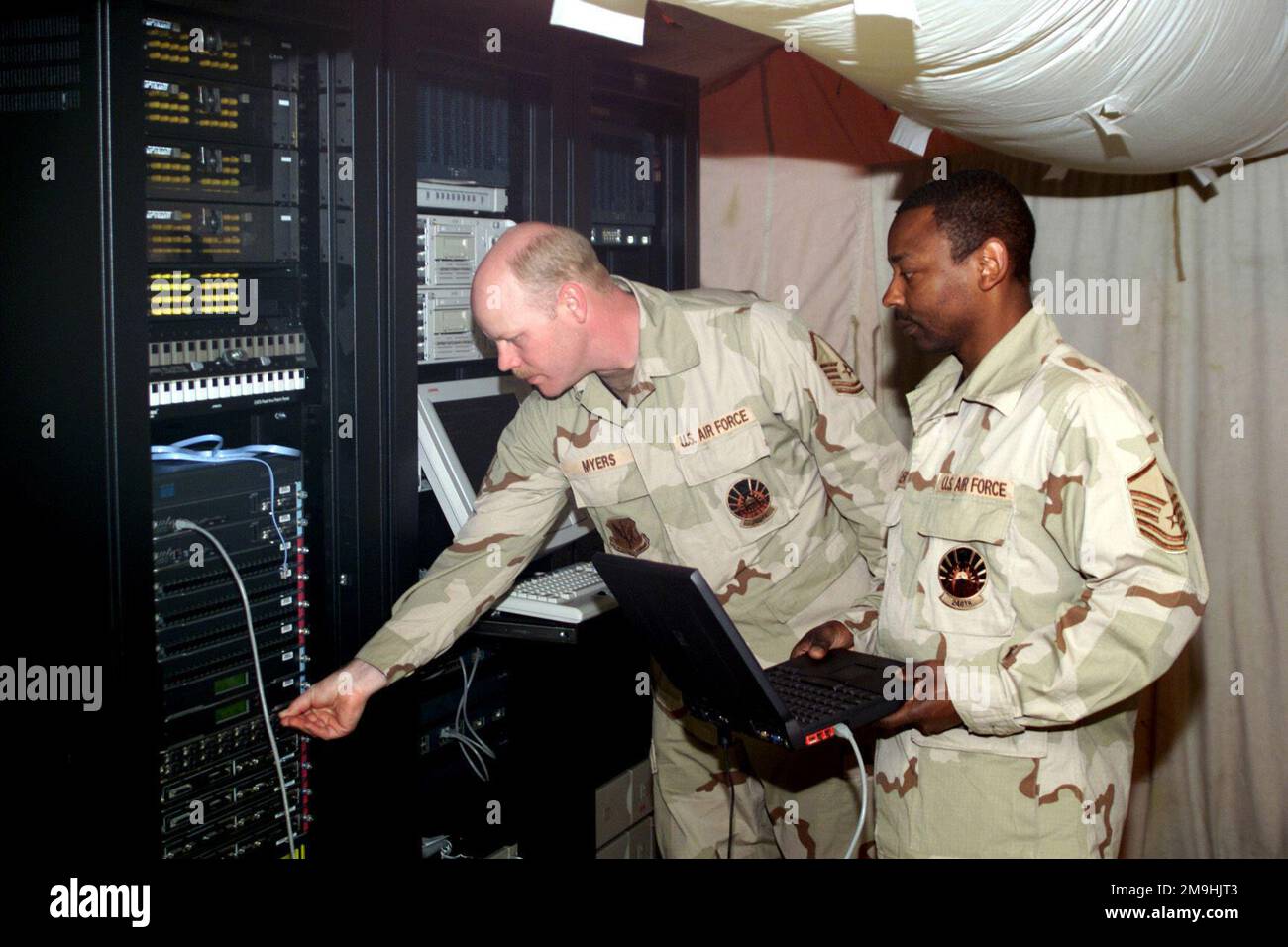 MASTER Sergeant (MSGT) Robert Butler, right, tests the base Network ...