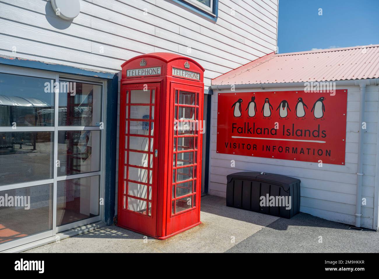 A London red phone booth in front of a house on Ross Road in Port ...