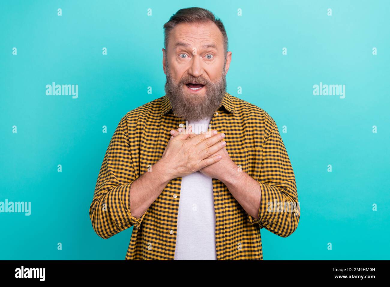 Closeup photo of mature aged man grey hair long beard touch hands chest ...